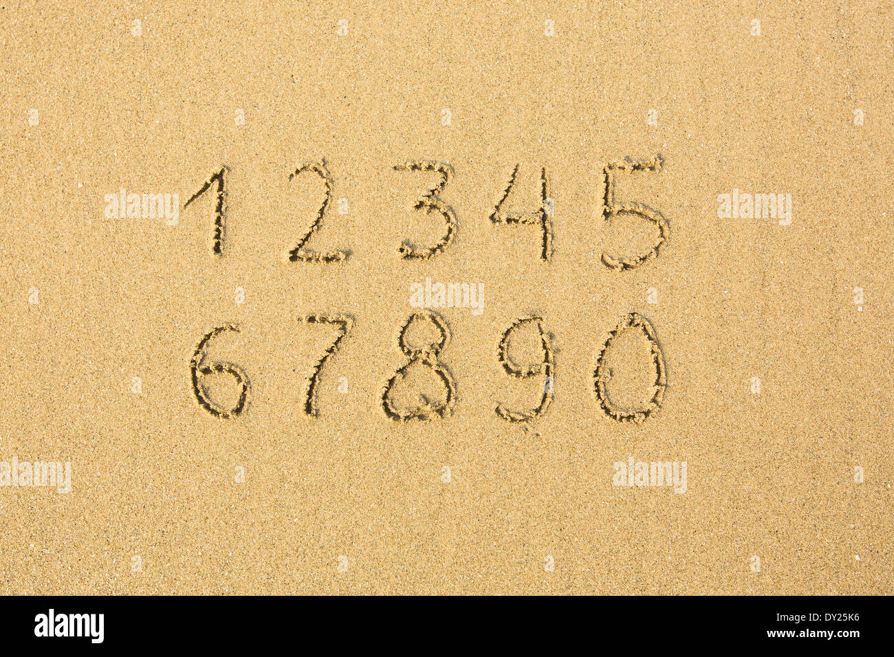 Numbers written on a sandy beach Stock Photo - Alamy
