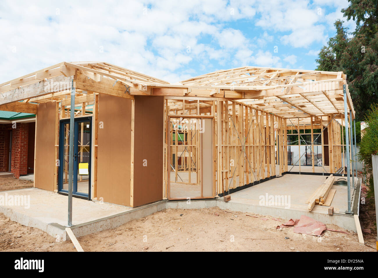 New residential construction home wooden framing against a blue sky ...