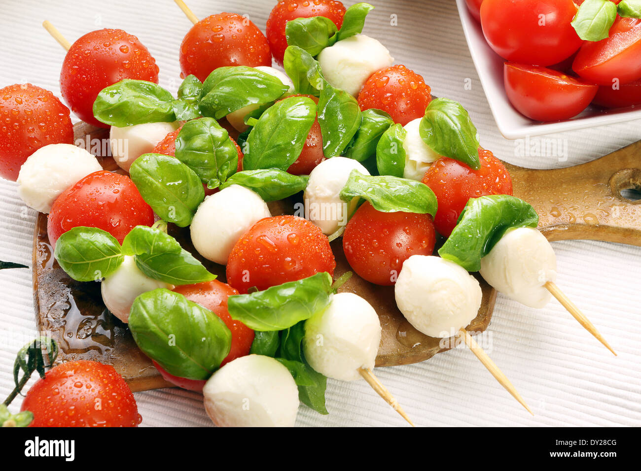 Caprese salad. Skewers with tomato and mozzarella with basil Stock ...