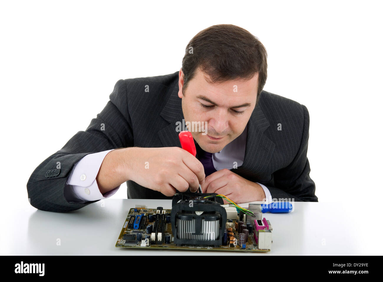 Computer Engineer working in a motherboard, isolated Stock Photo - Alamy