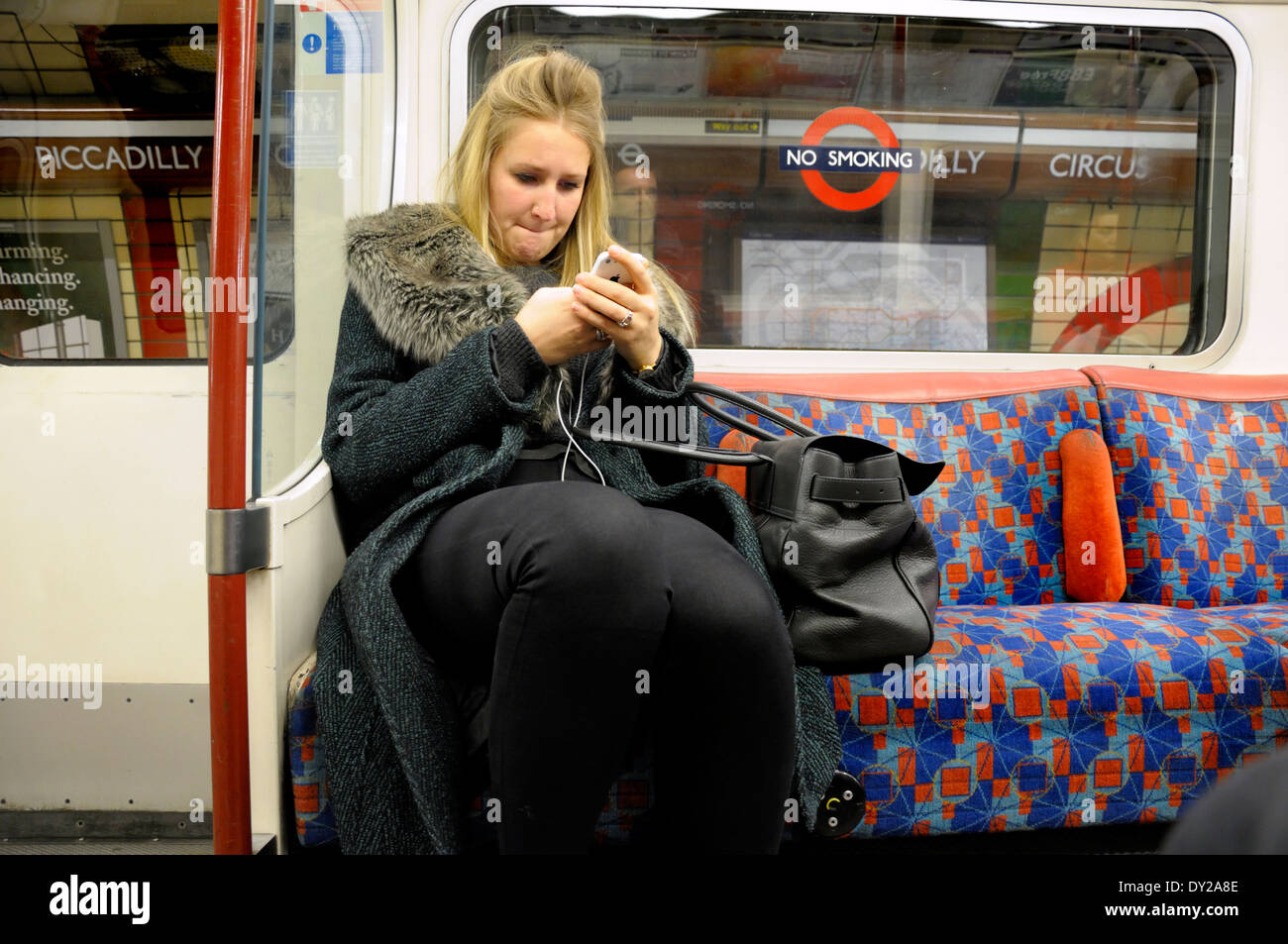 People using phones train hi-res stock photography and images - Alamy