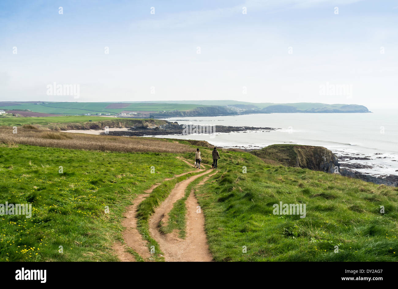 Thurlestone, Devon, England. April 1st 2014. Two female walkers and ...
