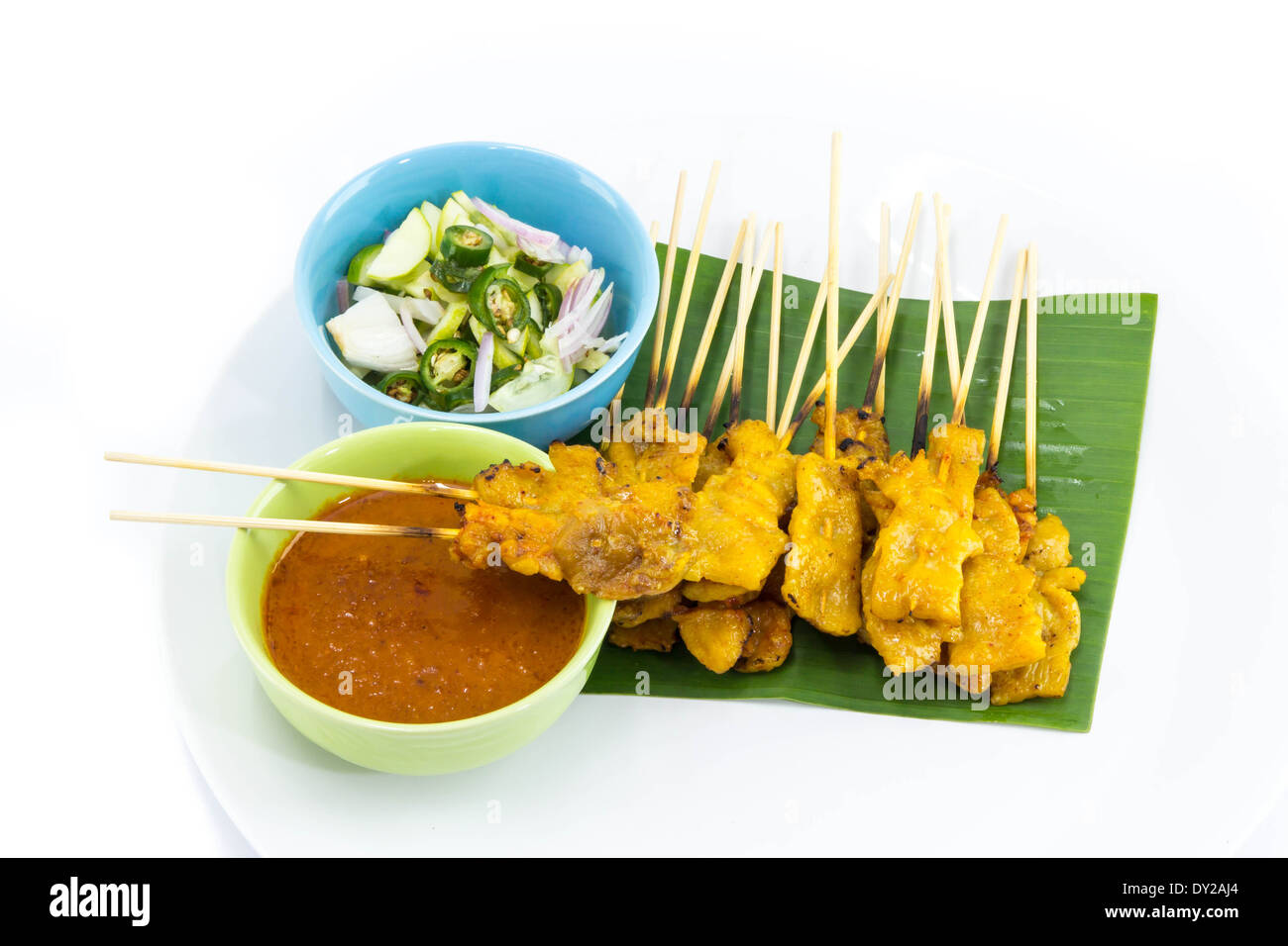 Pork Satay with Peanut Sauce on white background Stock Photo - Alamy