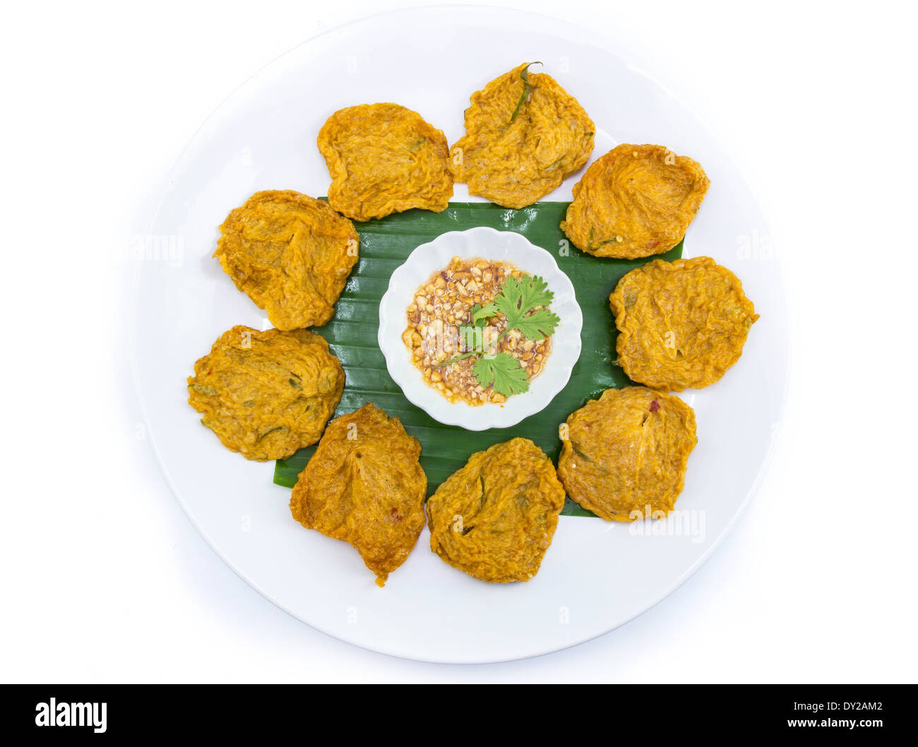 Fried fish patty on white background Stock Photo - Alamy