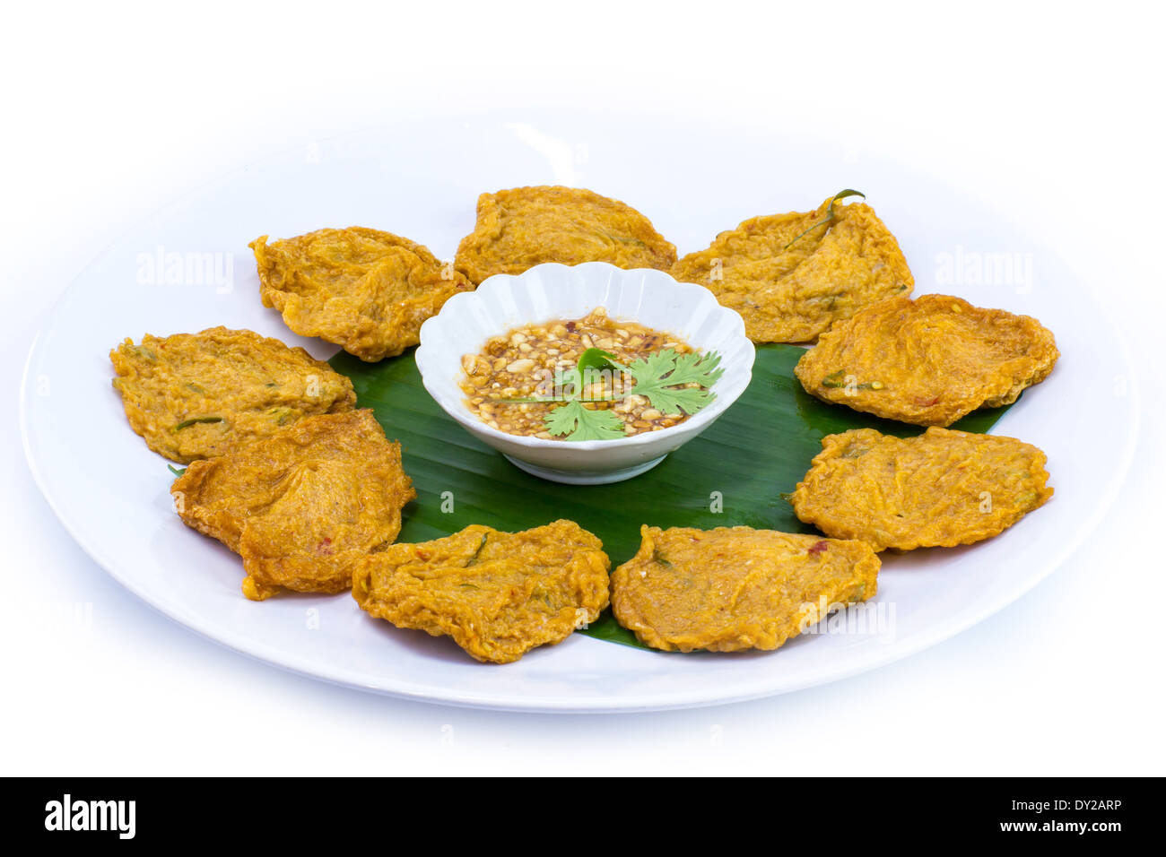 Fried fish patty on white background Stock Photo - Alamy