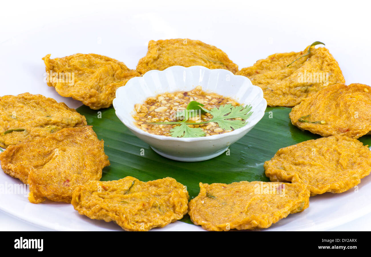 Fried fish patty on white background Stock Photo - Alamy