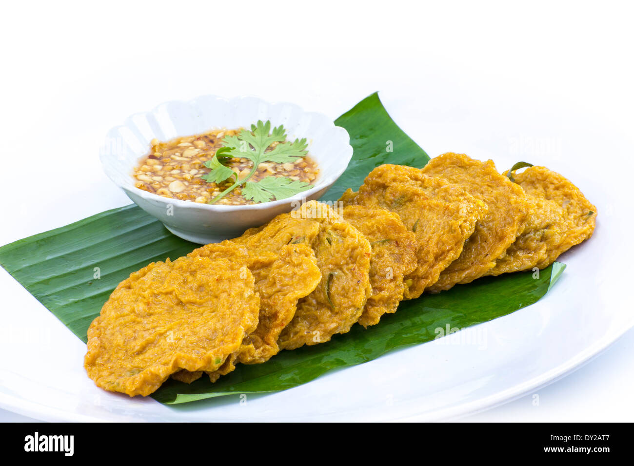 Fried fish patty on white background Stock Photo - Alamy