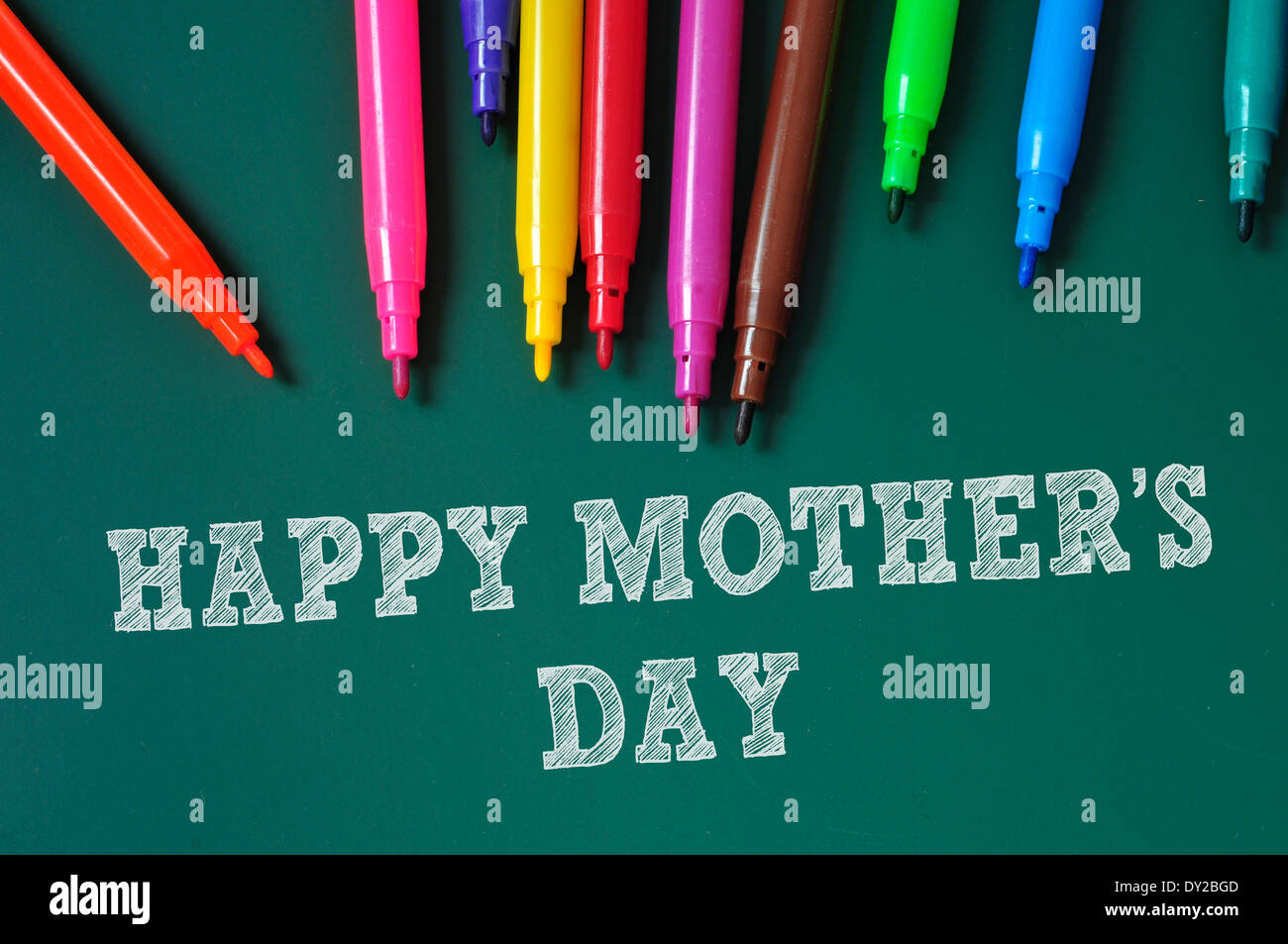 Sentence Happy Mothers Day Written In A Green Chalkboard And Some Felt sentence-happy-mothers-day-written-in-a-green-chalkboard-and-some-felt