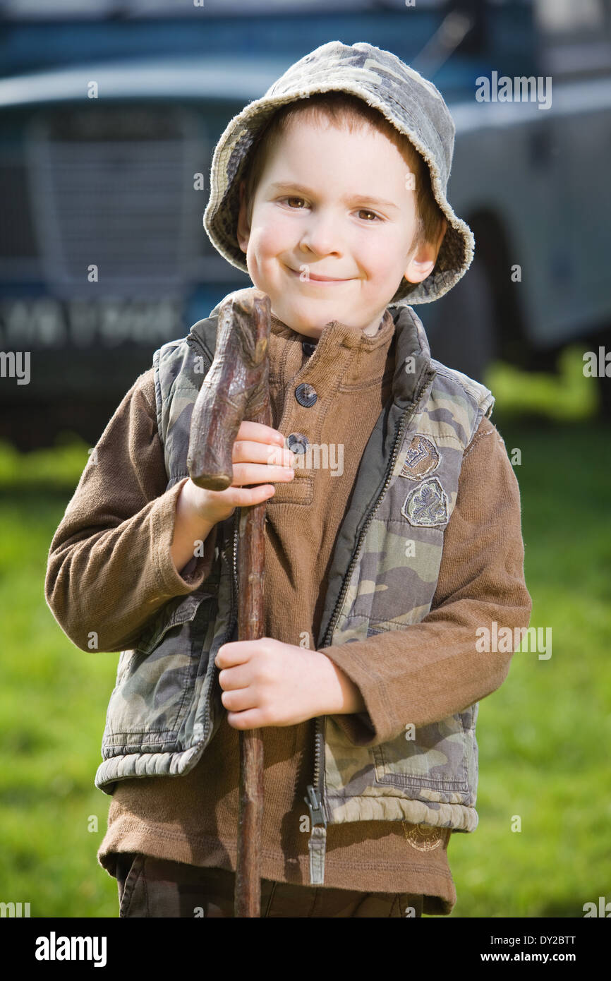 Boy holding stick hi-res stock photography and images - Alamy Boy holding stick hi-res stock photography and images - Alamy