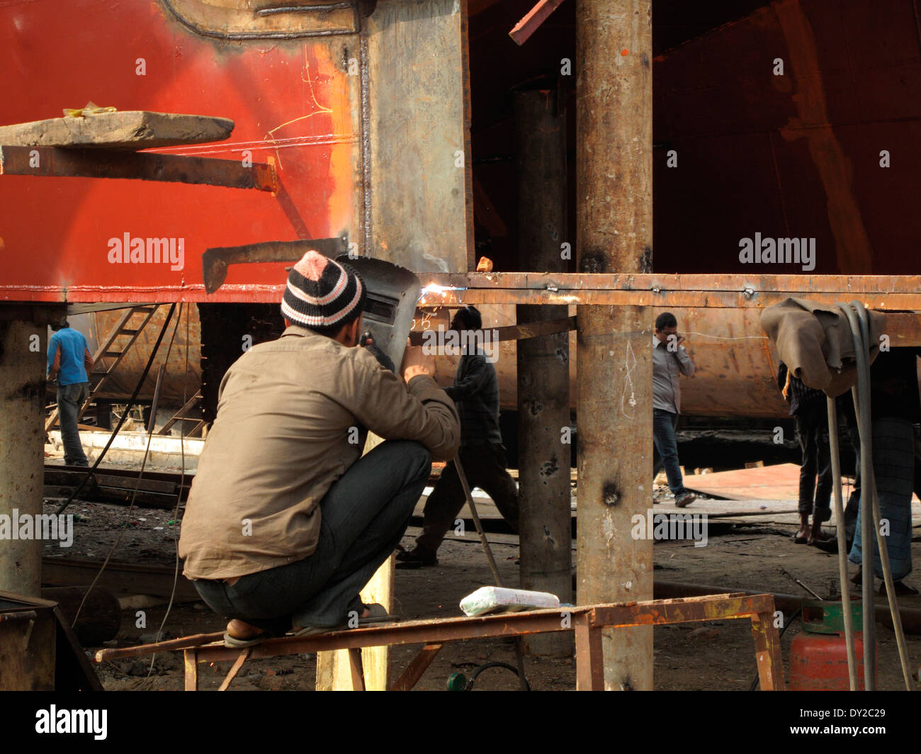 Man welding in flip flops Stock Photo - Alamy