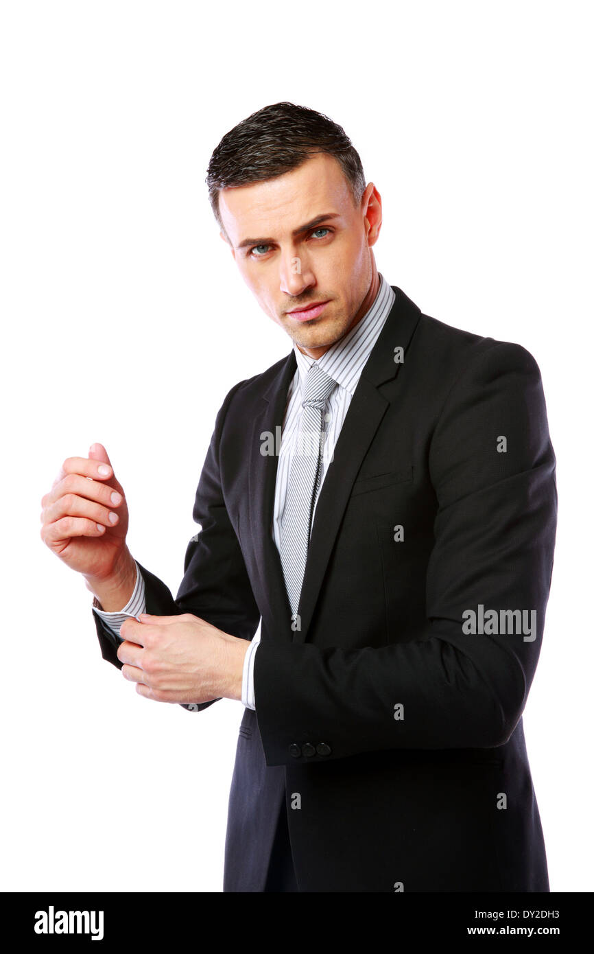 Businessman buttoning cuff sleeves isolated on a white background Stock ...