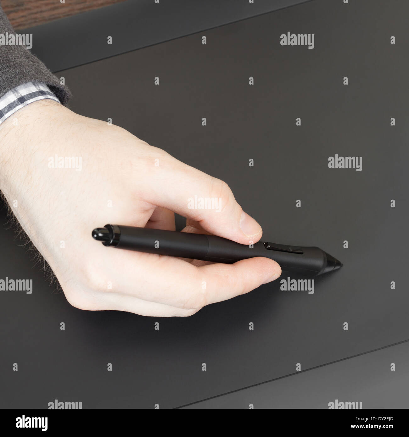 Man drawing something with help of professional graphic tablet and pen ...