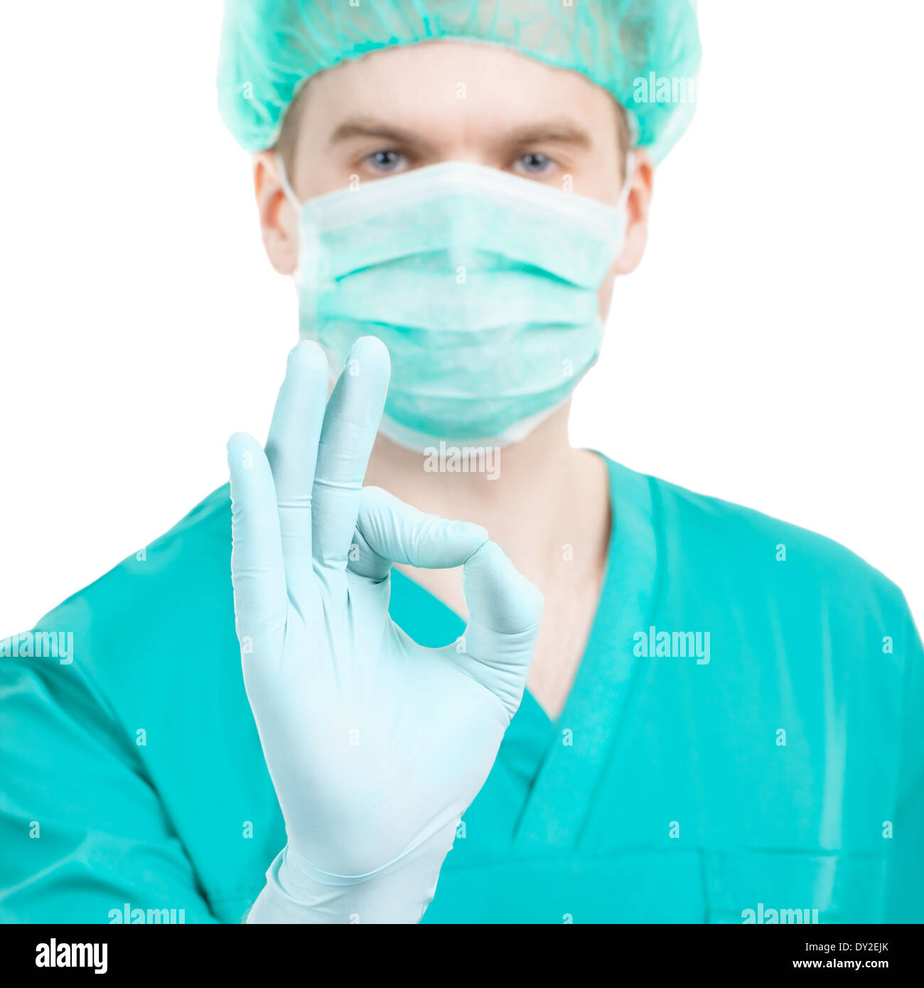 Studio shoot of a confident young doctor showing ok sign and isolated ...