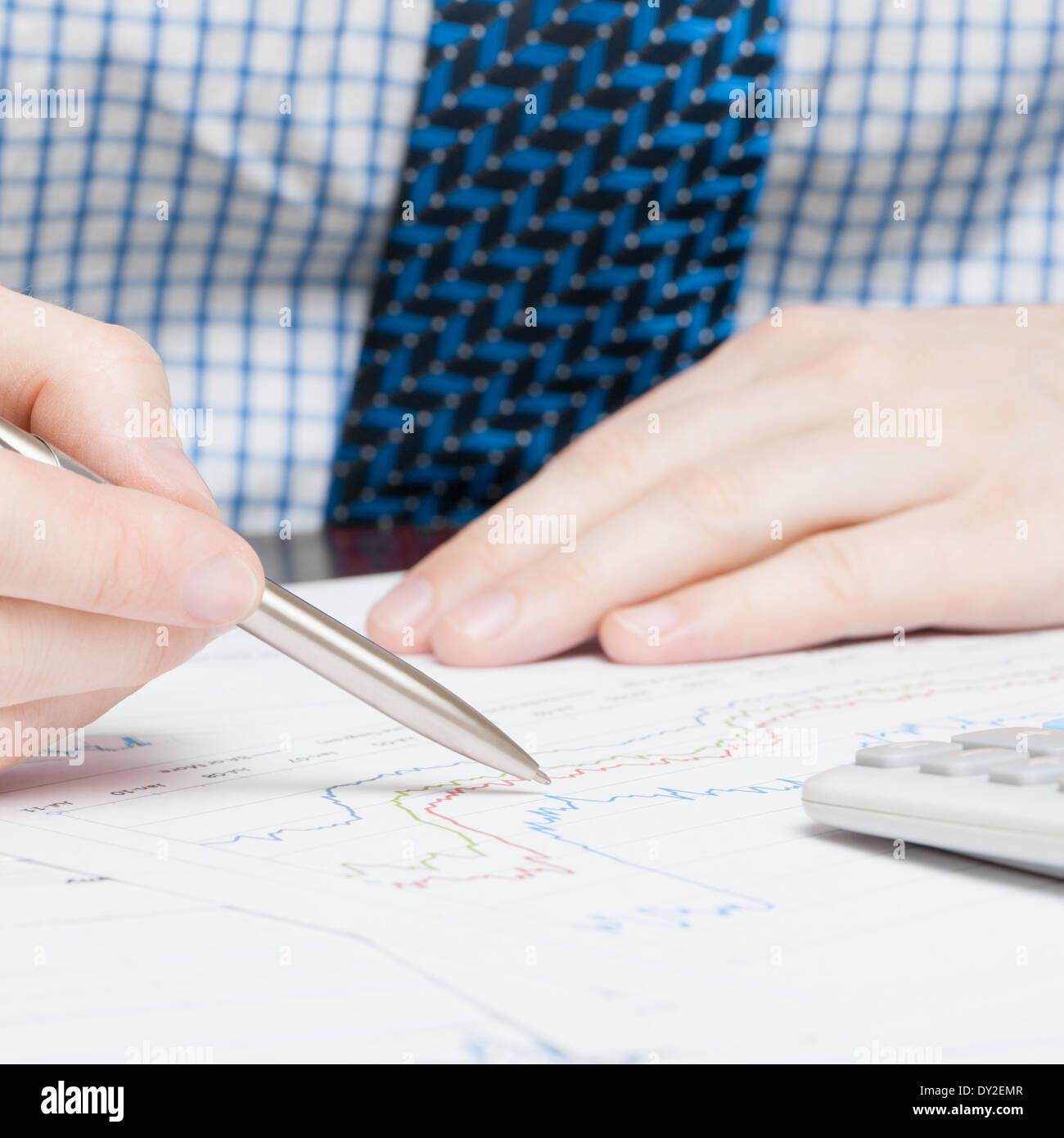 Business man doing calculations at the desk Stock Photo - Alamy