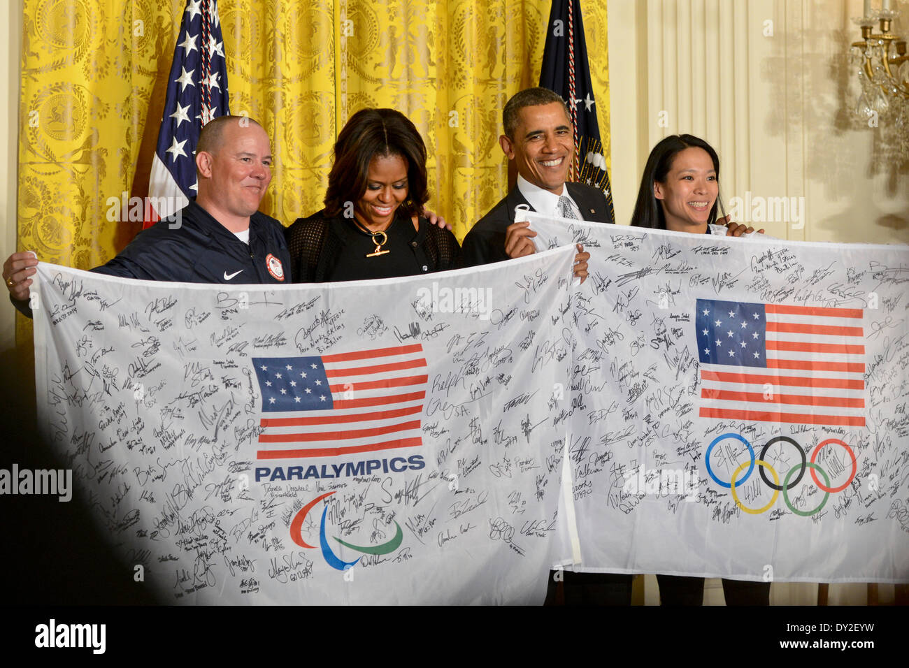 US President Barack Obama and first lady Michelle Obama are presented ...
