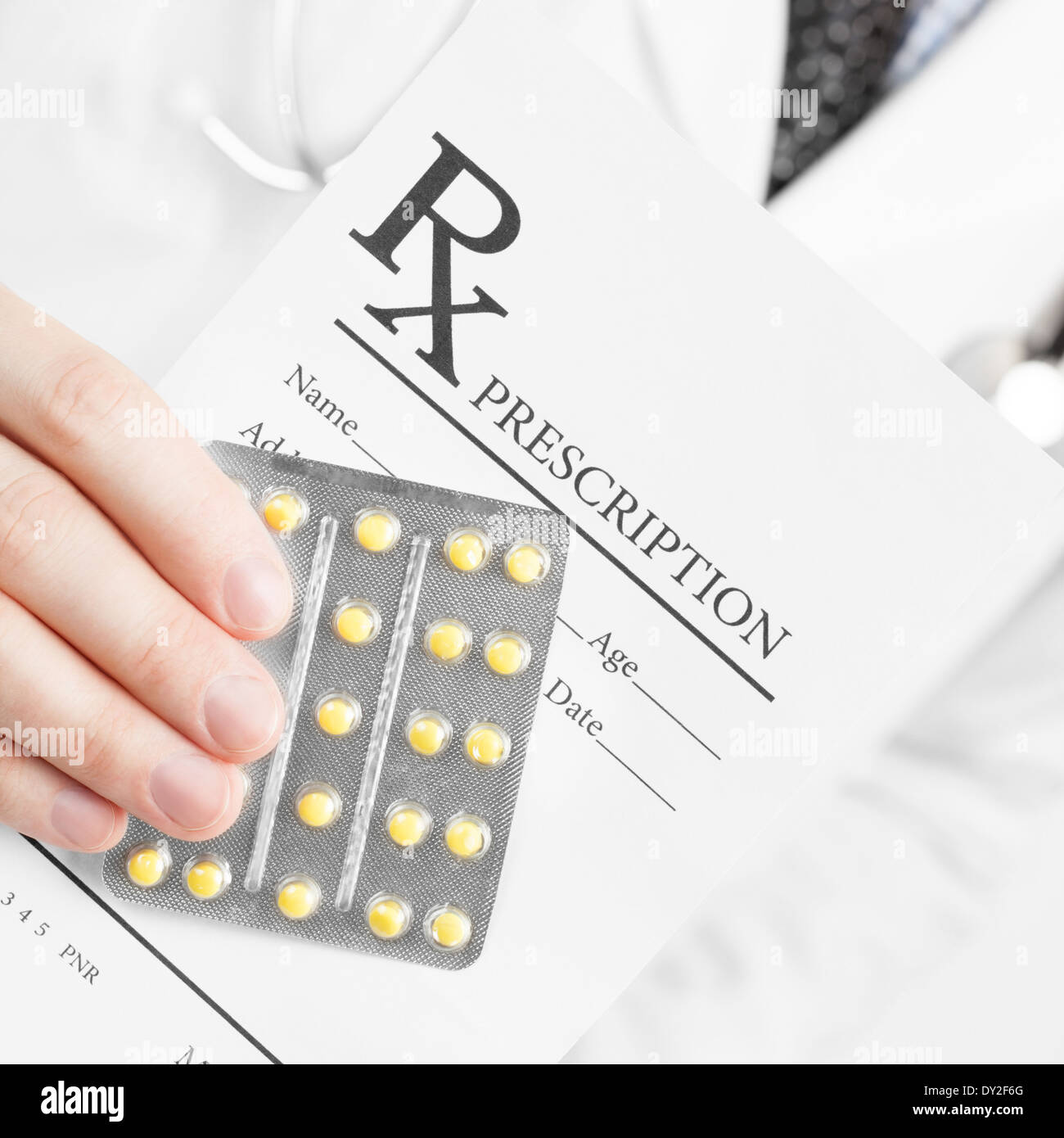 Medical doctor holding prescription in his hand Stock Photo - Alamy