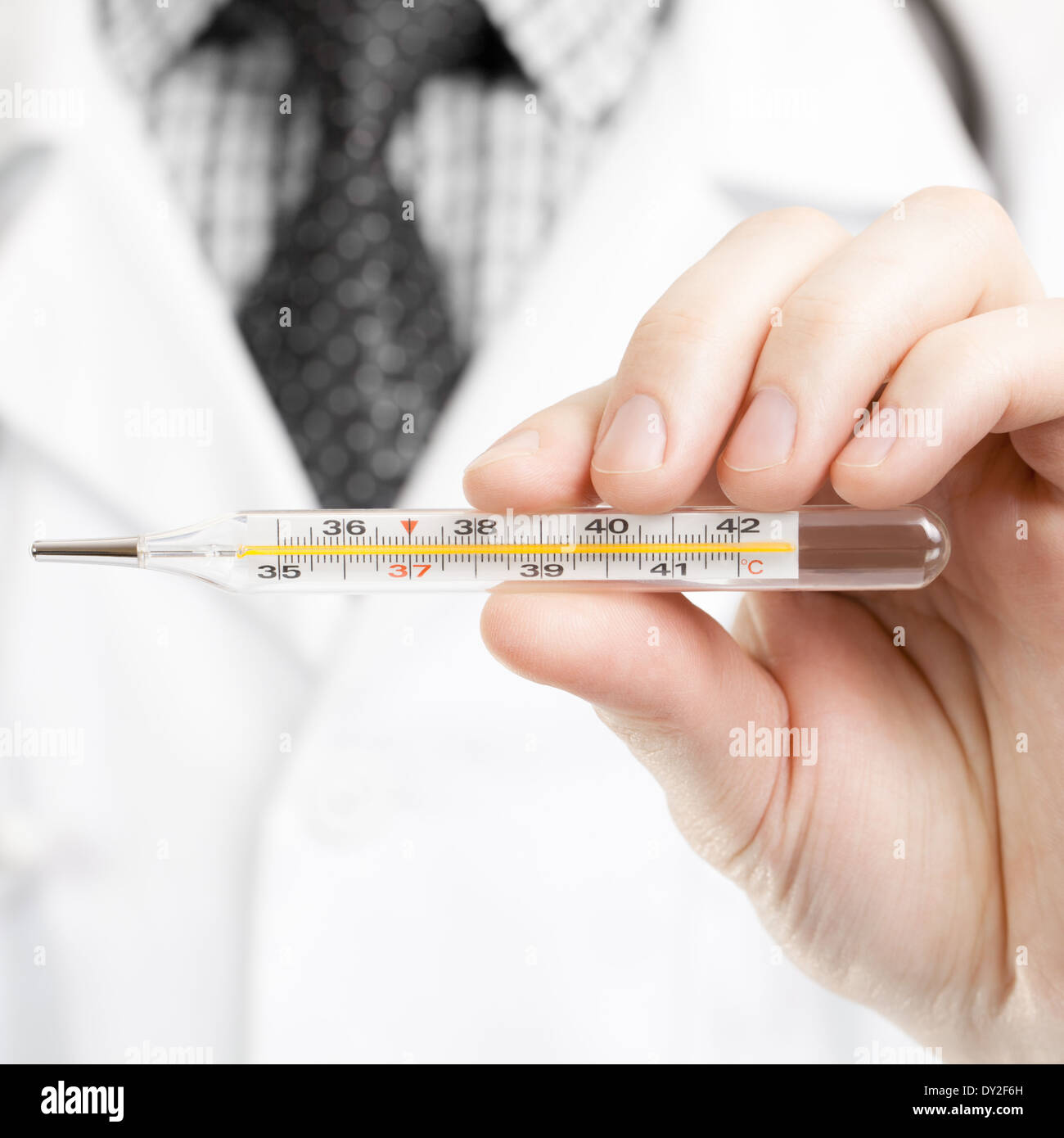 Doctor with a thermometer in his hand Stock Photo - Alamy