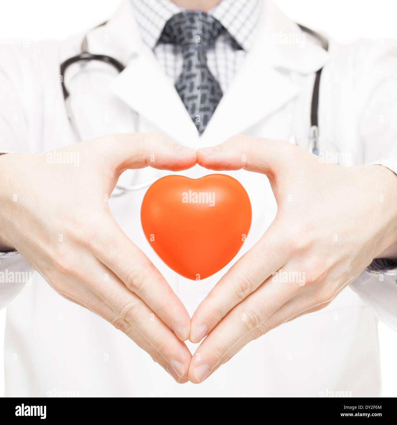 Doctor making heart shape with his hands around heart toy isolated on ...
