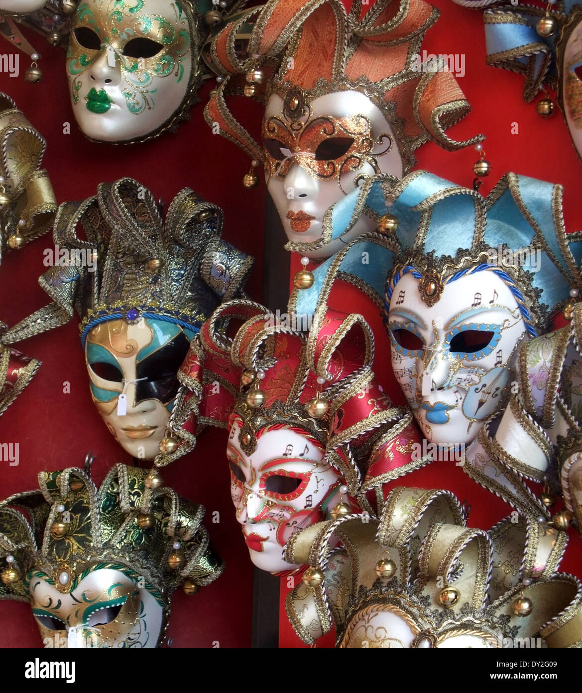 lots of colorful masks in red back, seen in Italy Stock Photo - Alamy