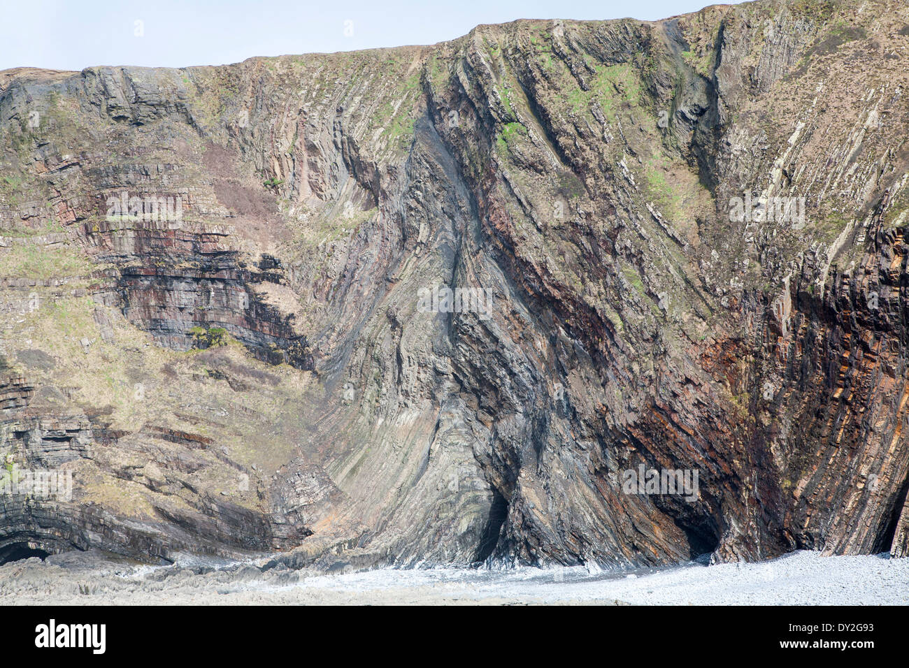 Complex folding of sedimentary rock strata in coastal cliffs at ...