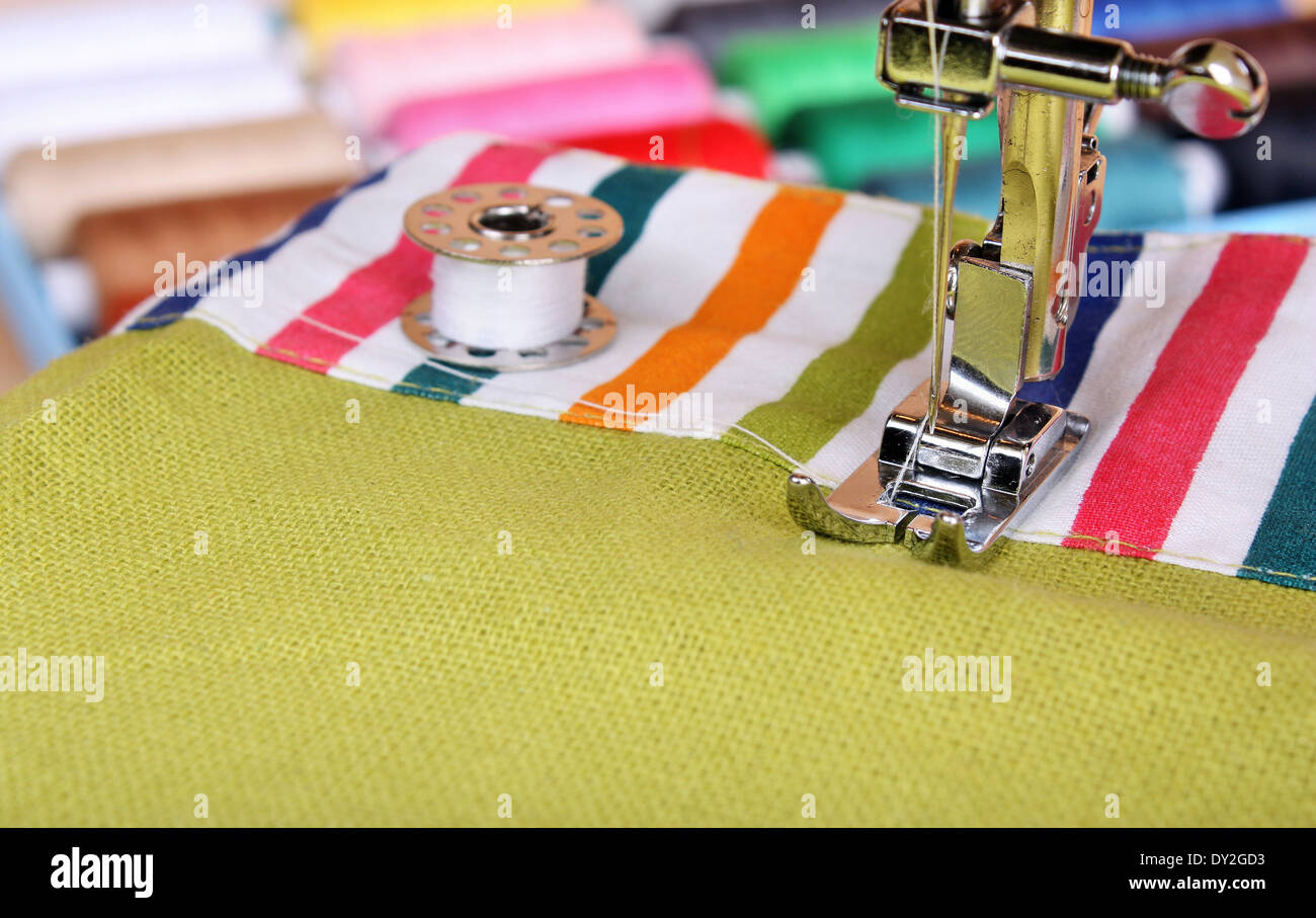 Sewing machine and item of clothing material background threads Stock ...