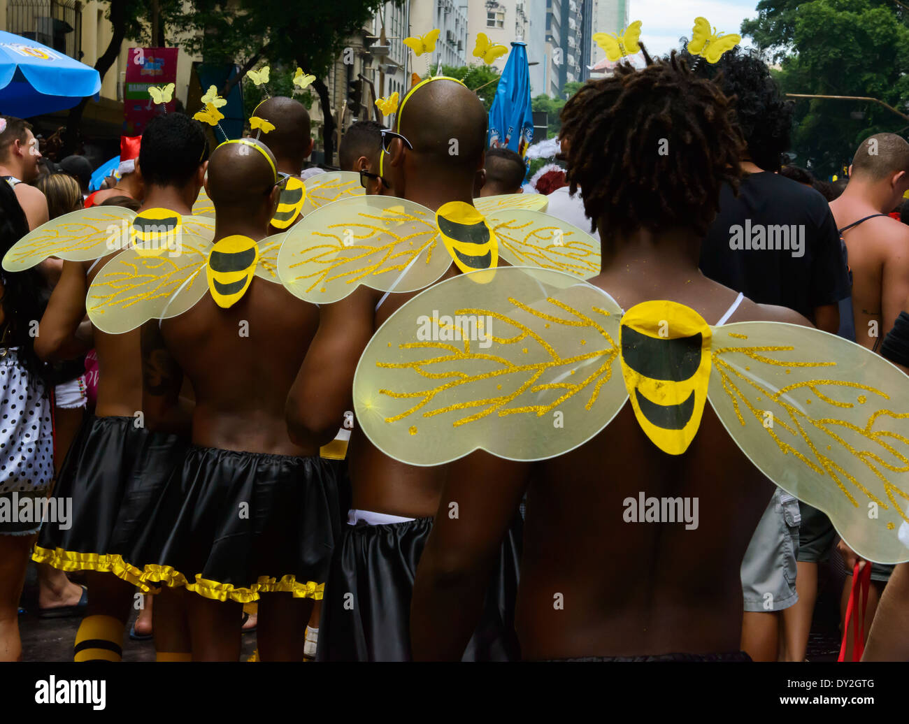 Black men dressed as bees, street party, Rio de Janeiro, Brazil ...