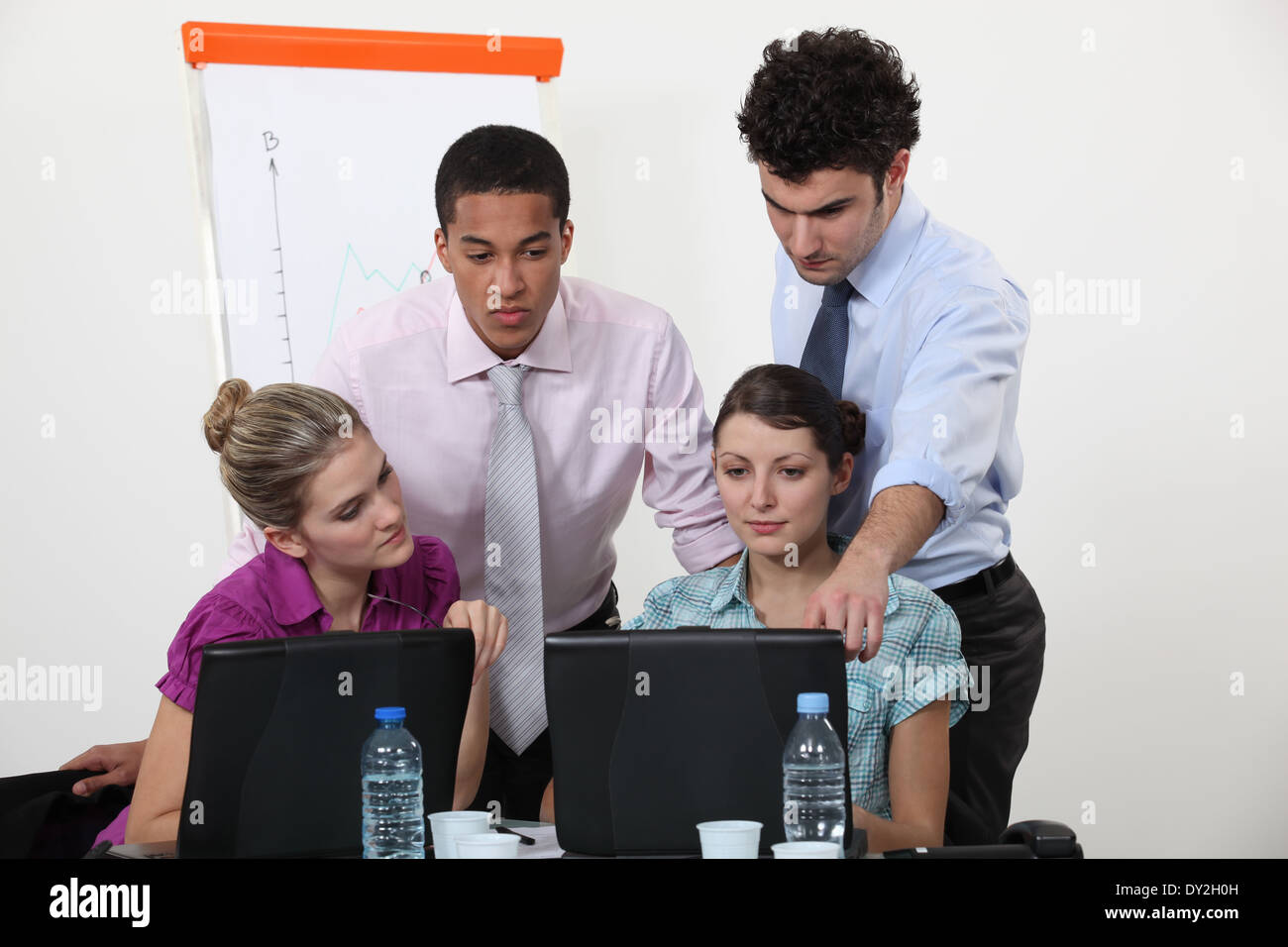Young people working on a business presentation Stock Photo - Alamy