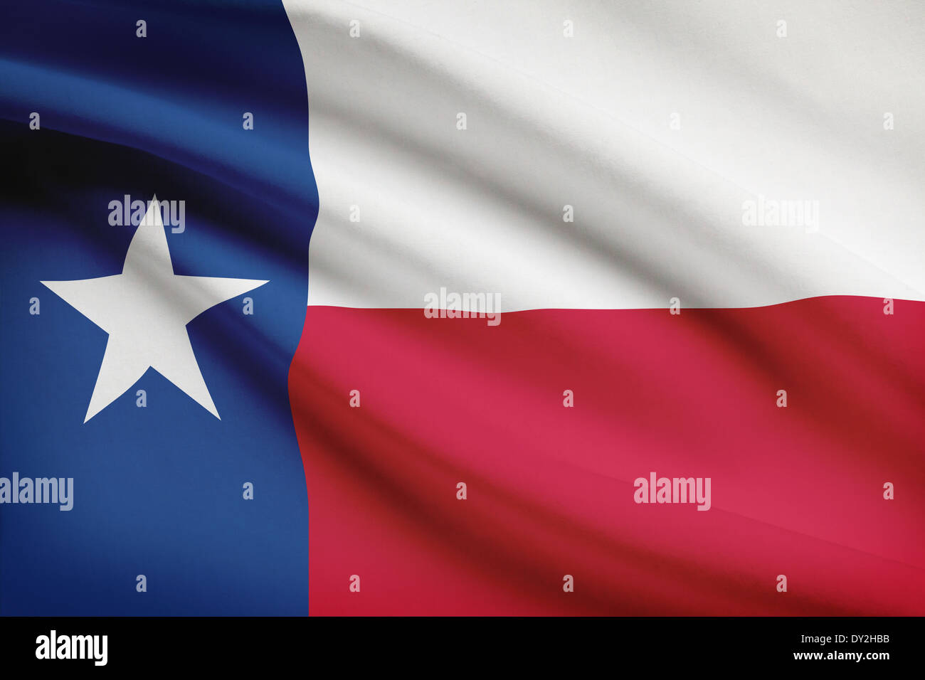 State of Texas flag blowing in the wind. Part of a series Stock Photo ...