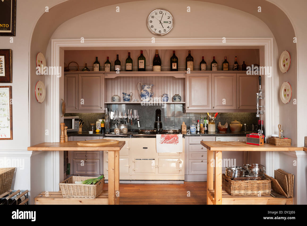 Alcoved kitchen cooking area with large aga and wooden work The ...