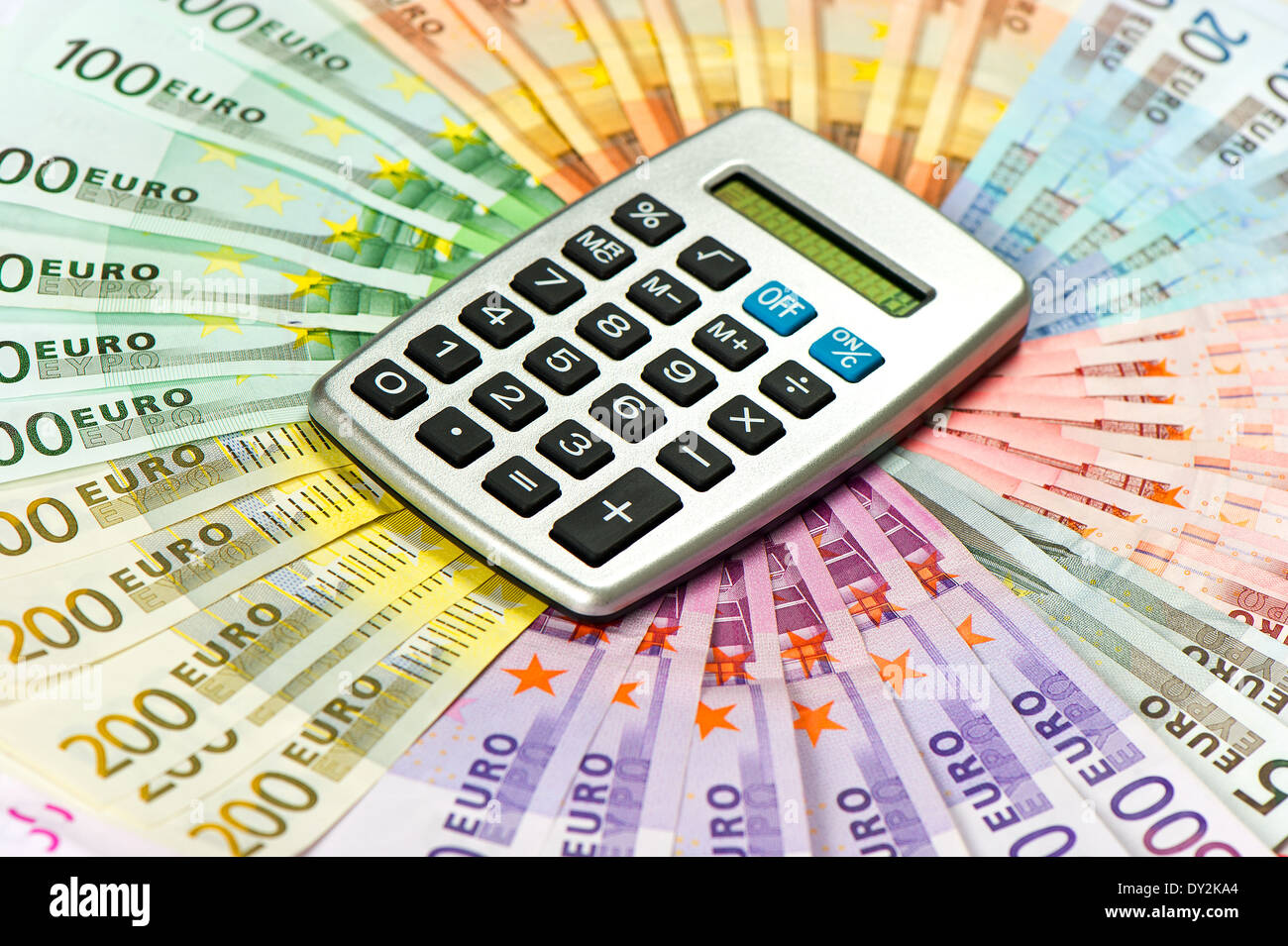 calculator on euro banknotes background Stock Photo - Alamy