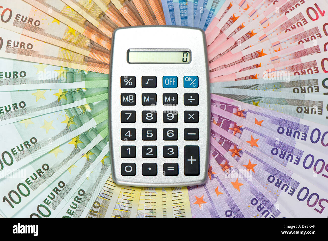 calculator on euro banknotes background Stock Photo - Alamy