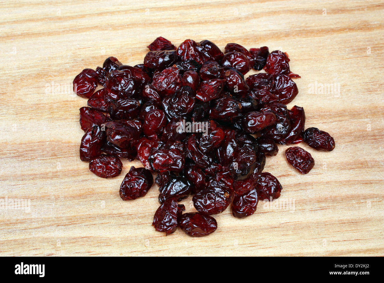 Dried cranberries fruit on wooden table Stock Photo - Alamy