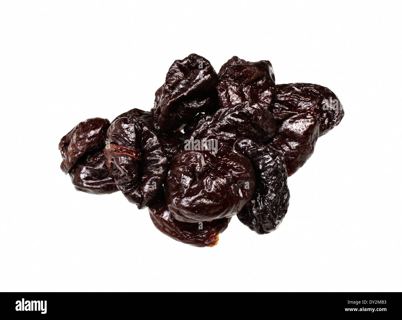 Dry plums or prunes fruit on a white background Stock Photo - Alamy