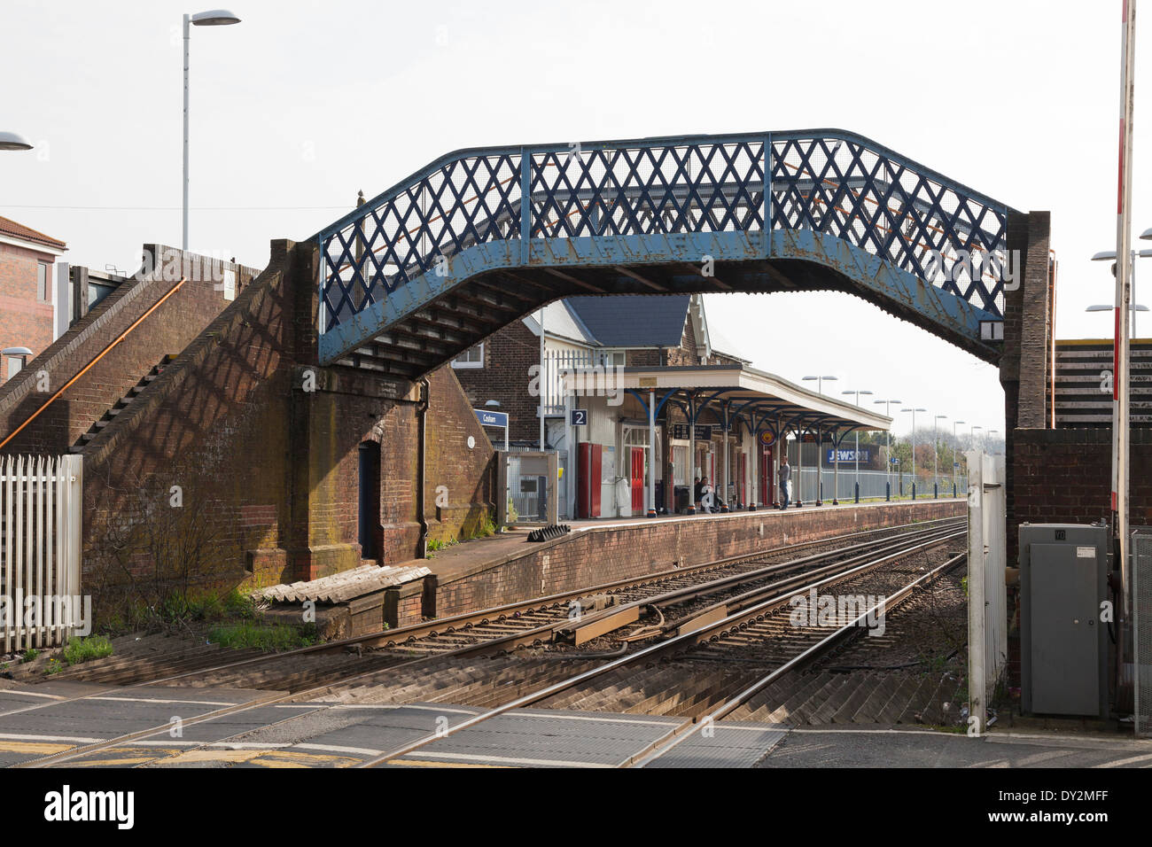 Old iron pedestrian bridge across railway by station Stock Photo - Alamy