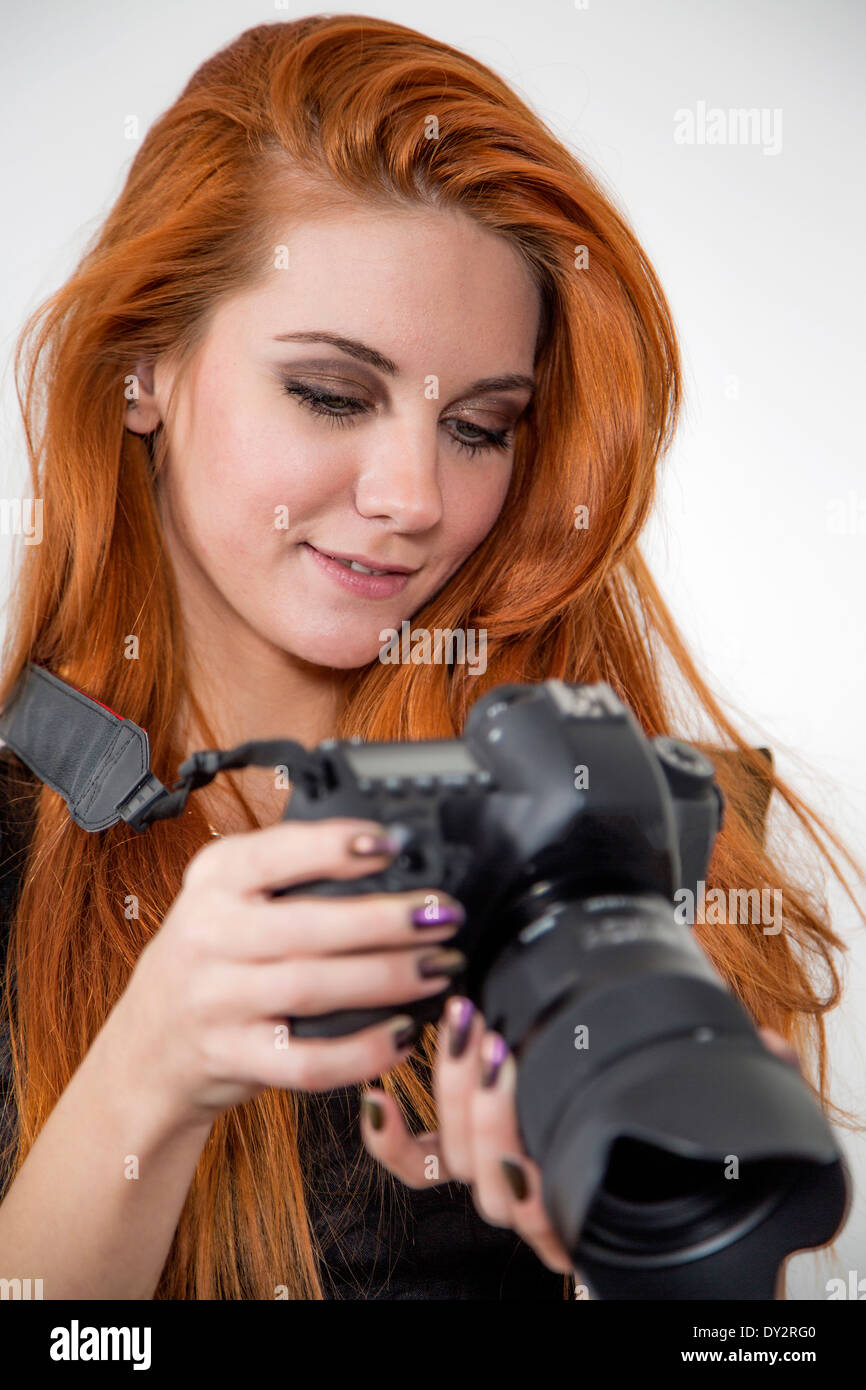 Pretty woman professional photographer dslr hi-res stock photography ...