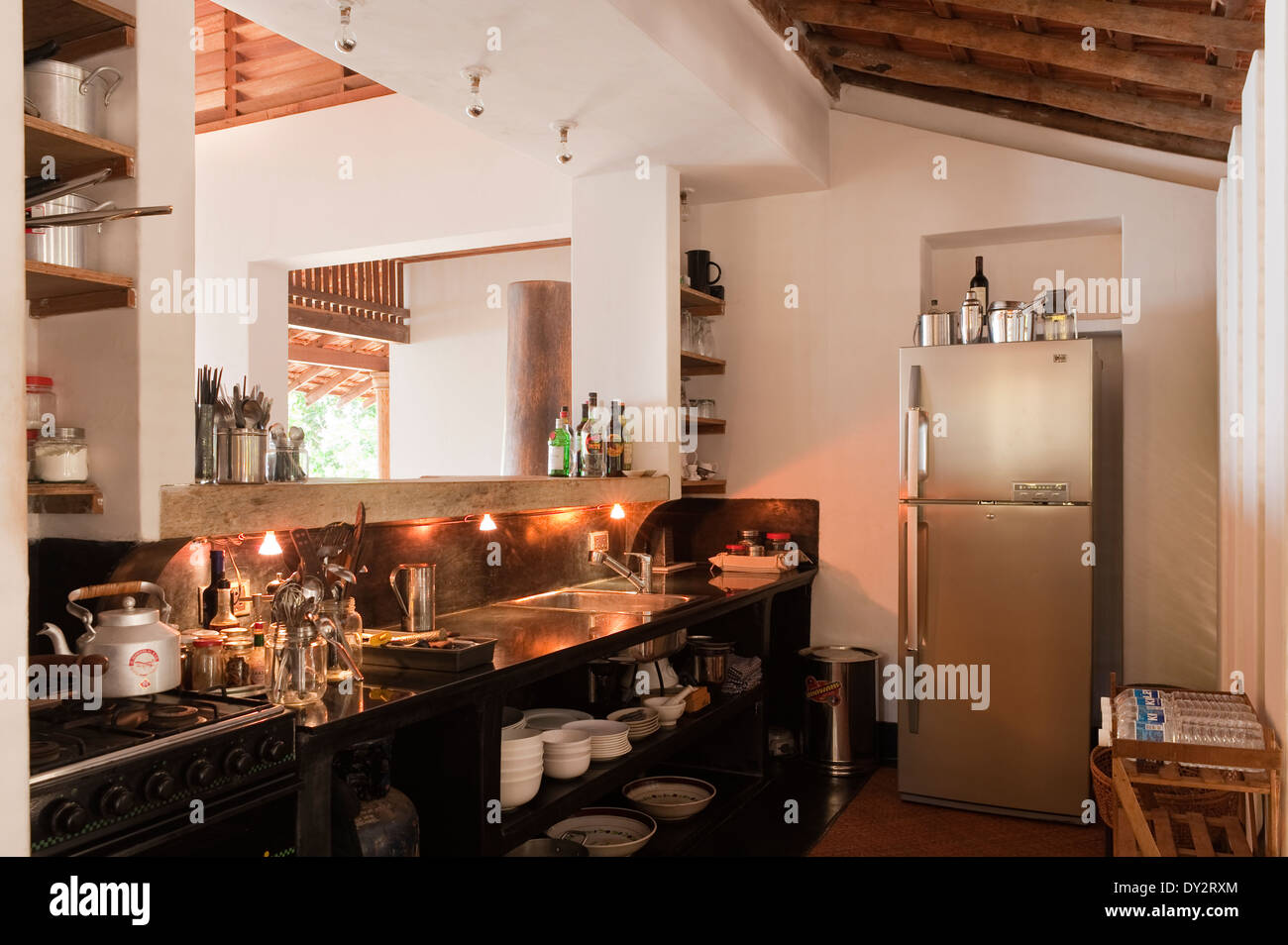 Kitchen storage in Goan beach house retreat, India Stock Photo - Alamy