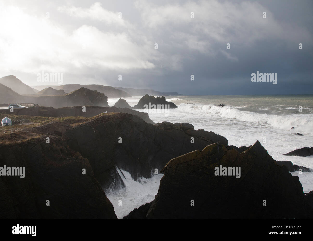 Large Atlantic storm waves crashing onto jagged rocky coast at Hartland ...