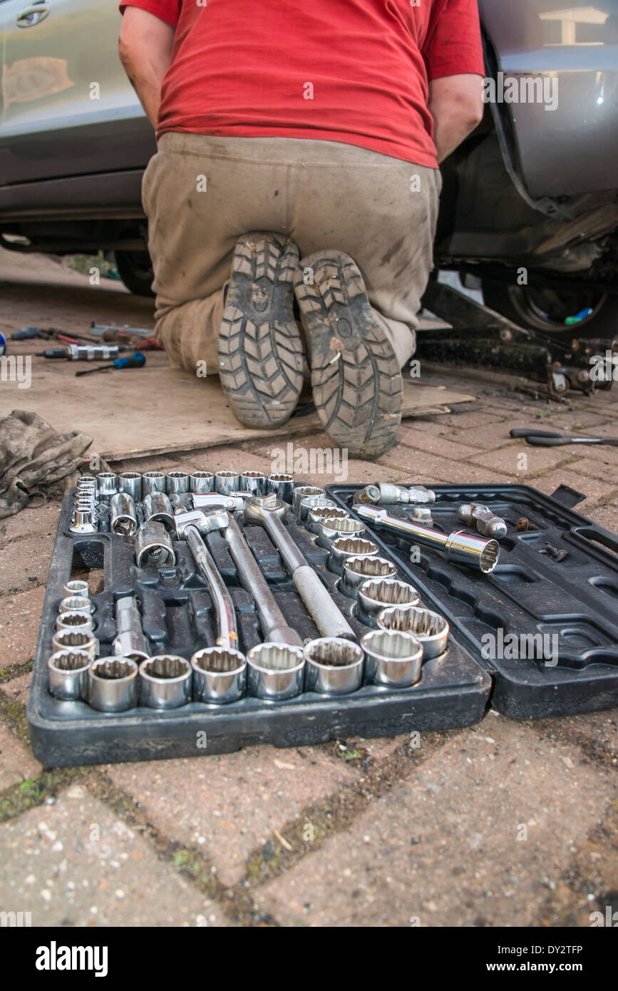 Mechanic working hard on car hi-res stock photography and images - Alamy