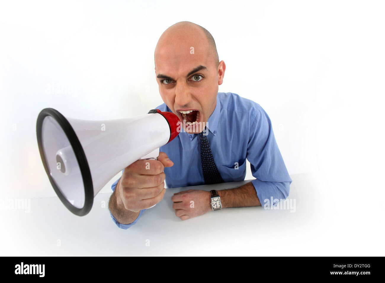 Man yelling into a megaphone Stock Photo - Alamy