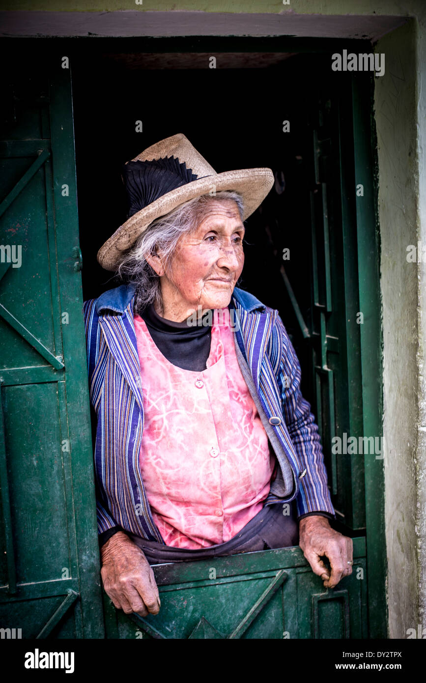 An older local woman with a weathered face in traditional dress. Huaraz ...