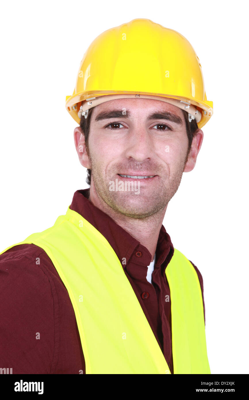 Builder wearing high-vis vest Stock Photo - Alamy