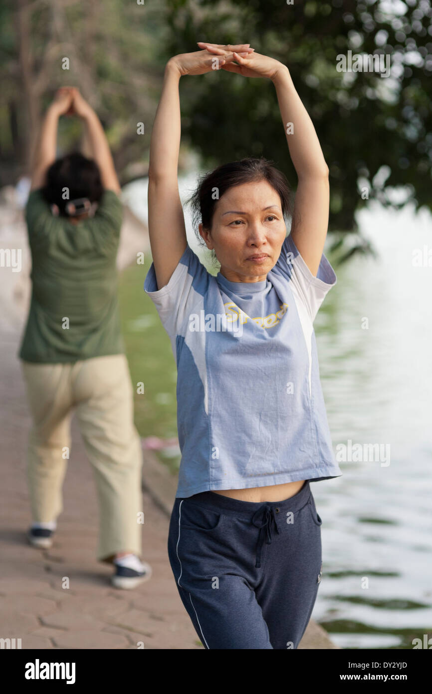 Hanoi, Vietnam. Women exercising by Hoan Kiem Lake, early morning Stock ...