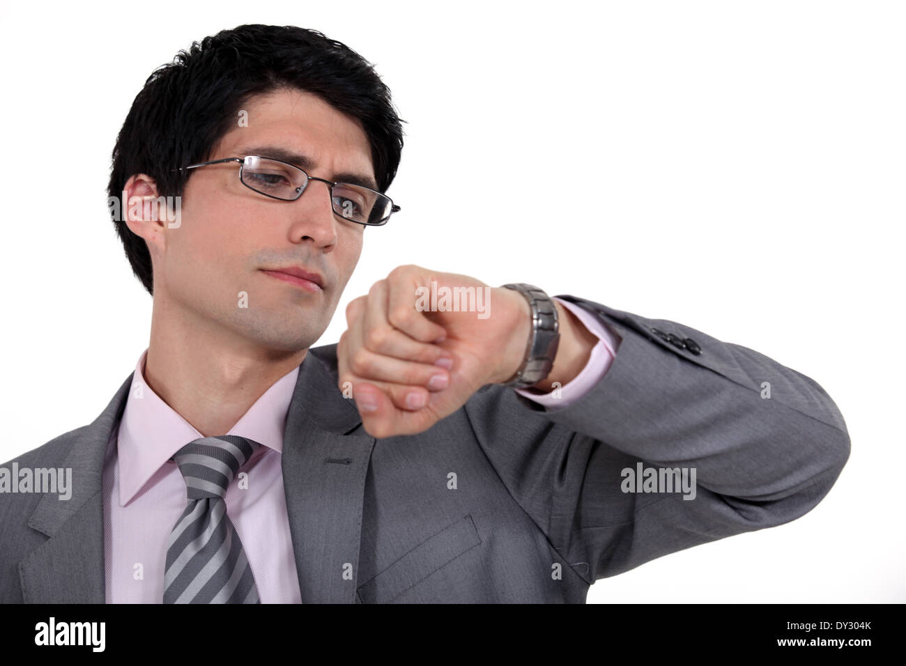 A businessman checking the time Stock Photo - Alamy