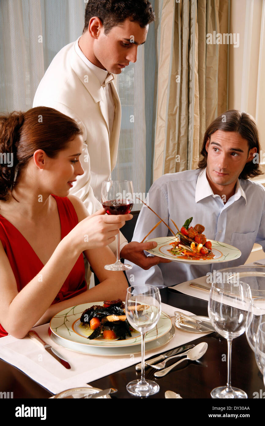 Hotel waiter serving guest hi-res stock photography and images - Alamy