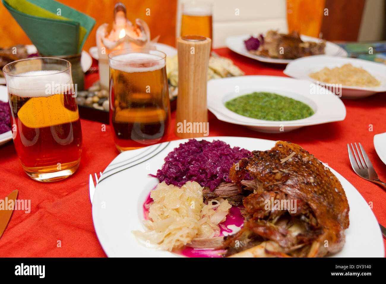 fried goose on a plate on a set table Stock Photo - Alamy