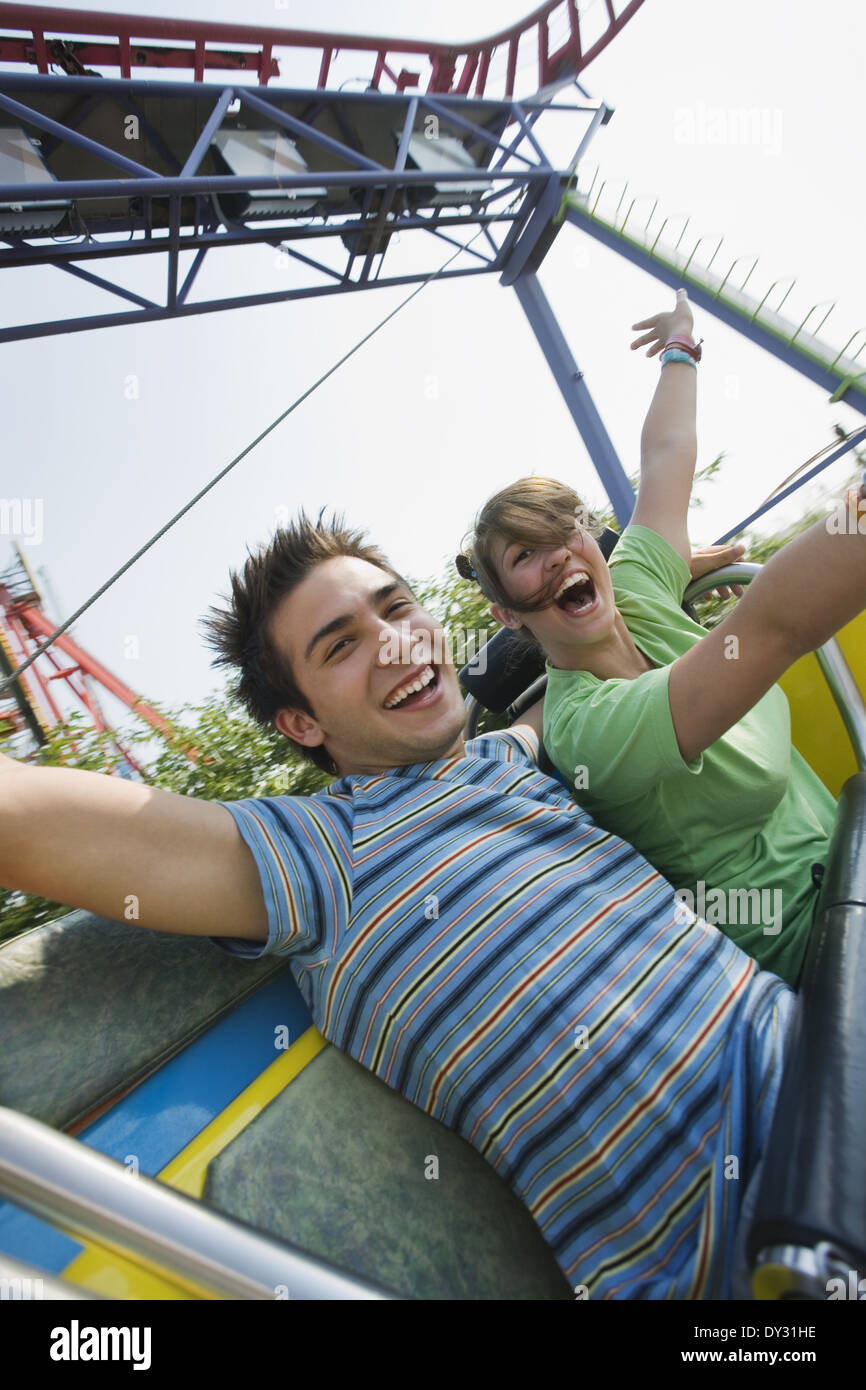 Teenage couple on roller coaster hi-res stock photography and images ...
