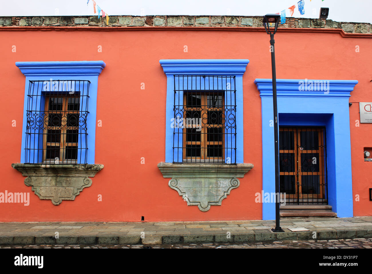 Bright blue windows and red walls, building in Oaxaca, Mexico Stock ...