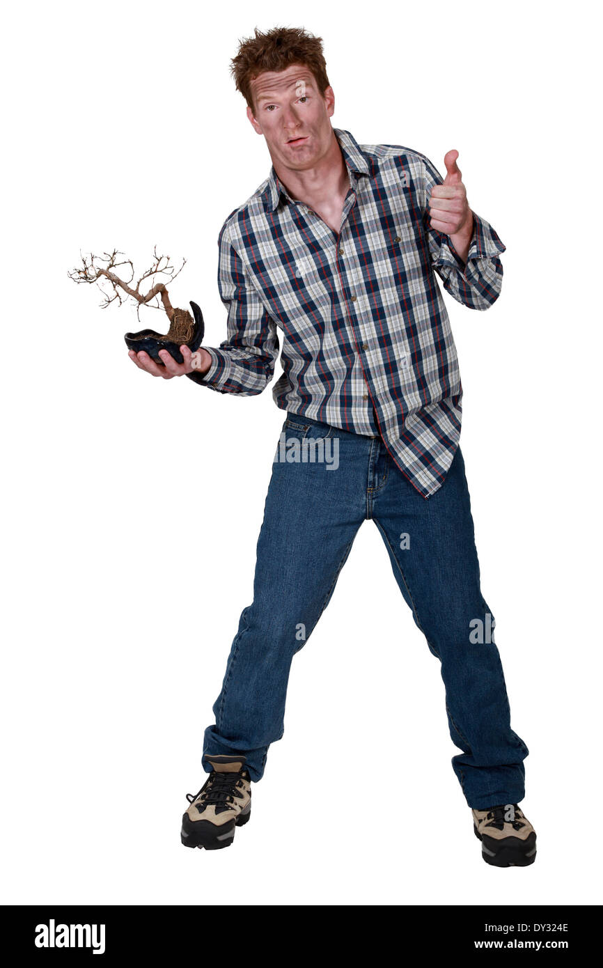 Man with bonsai in bad shape Stock Photo - Alamy