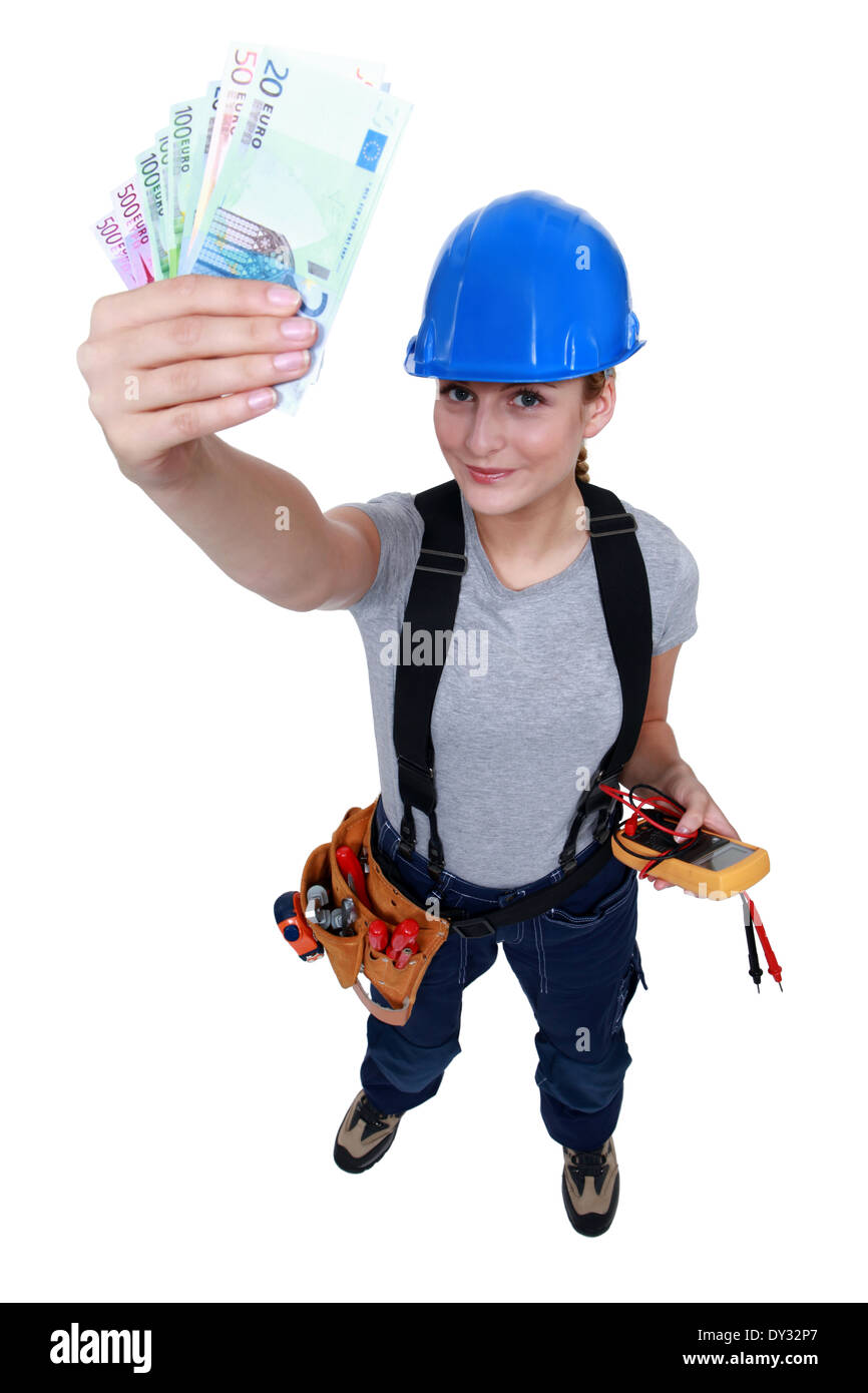Electrician with a handful of cash Stock Photo - Alamy