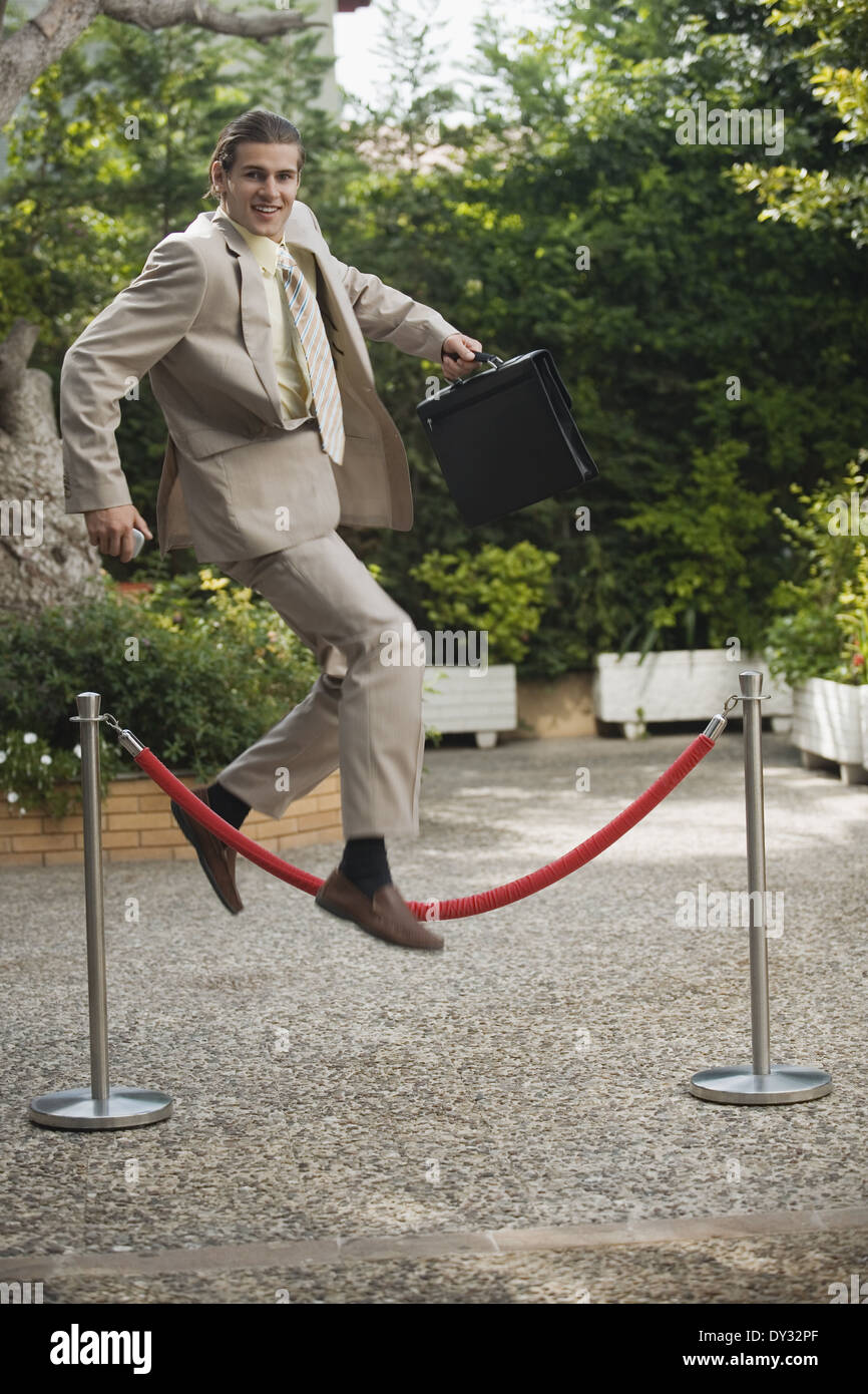 Jumping over barrier hi-res stock photography and images - Alamy
